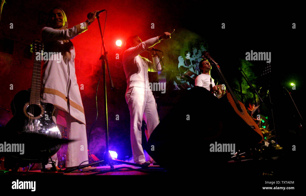 Arian plays guitar near the Milad tower in Tehran on October 2, 2005 ...