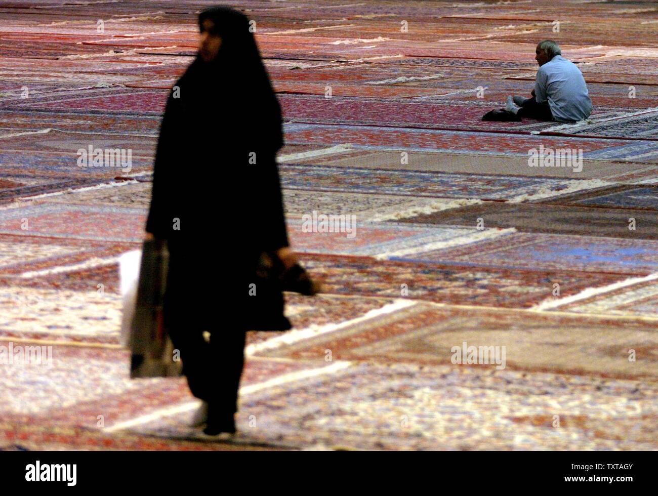 An Iranian man prays at the Imam Khomeini (Iran's late leader) grand ...