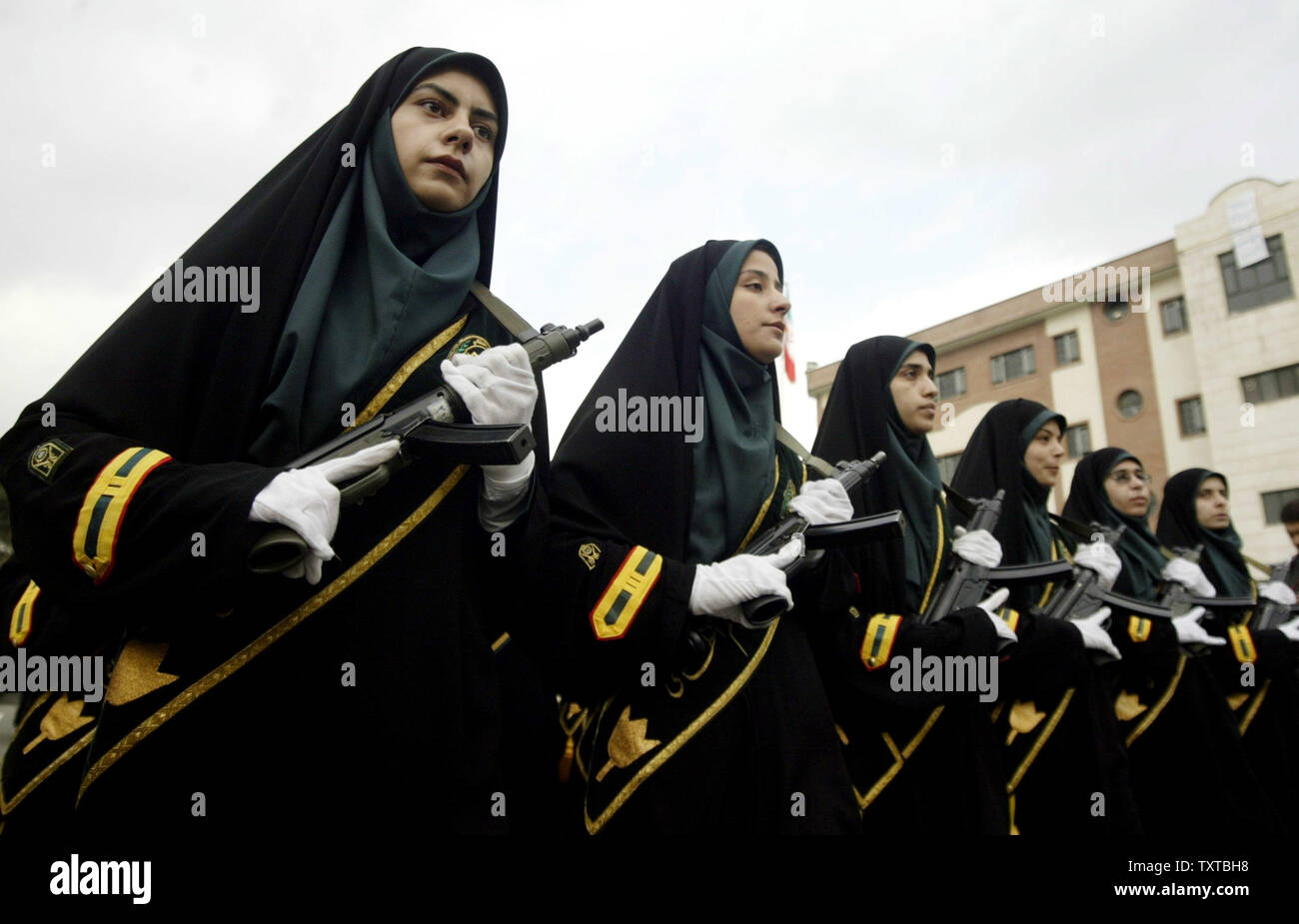 Iranian policewomen hold their guns as they march during their ...