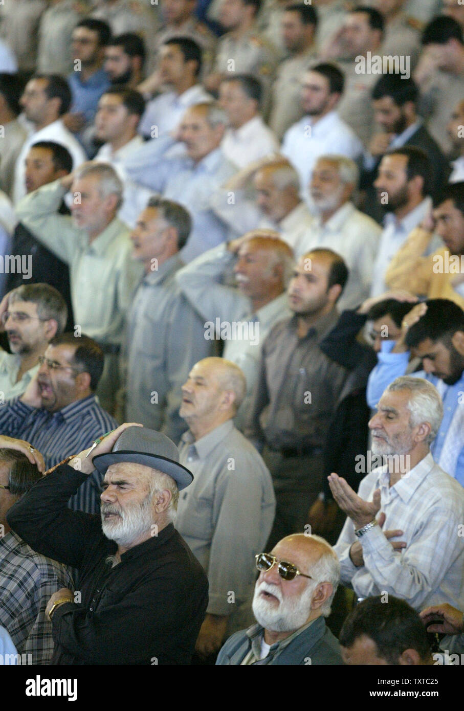 Iranians pray during the weekly Friday prayers at Tehran University in ...