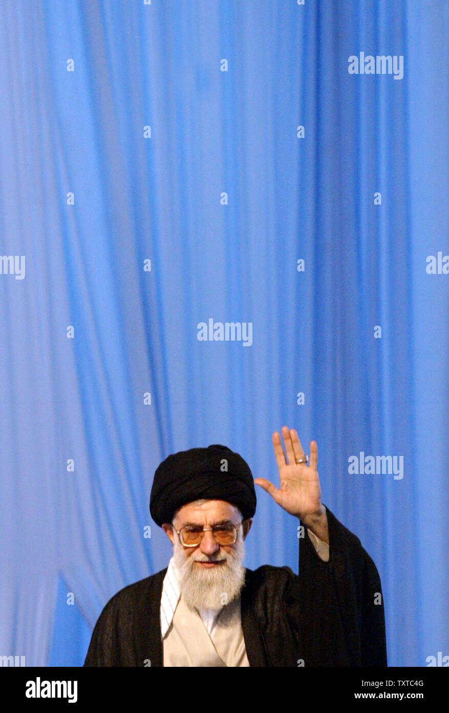 Iran's supreme leader Ayatollah Khamenei waves his hand as he attends a ...