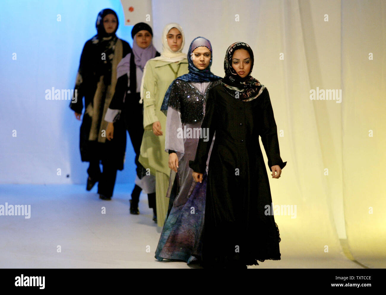 An Iranian model wears an Islamic dress made by Iranian designers at a ...