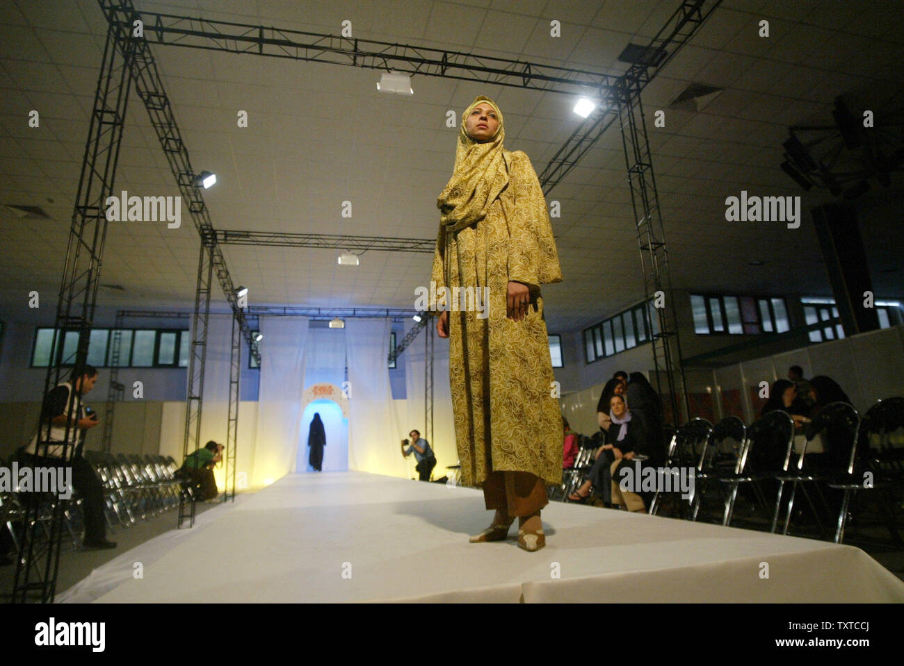 An Iranian model wears an Islamic dress made by Iranian designers at a ...