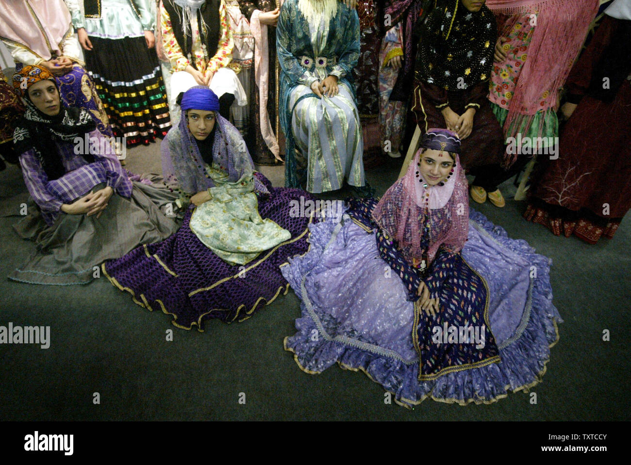 Iranian models wear traditional dresses made by Iranian designers at a ...