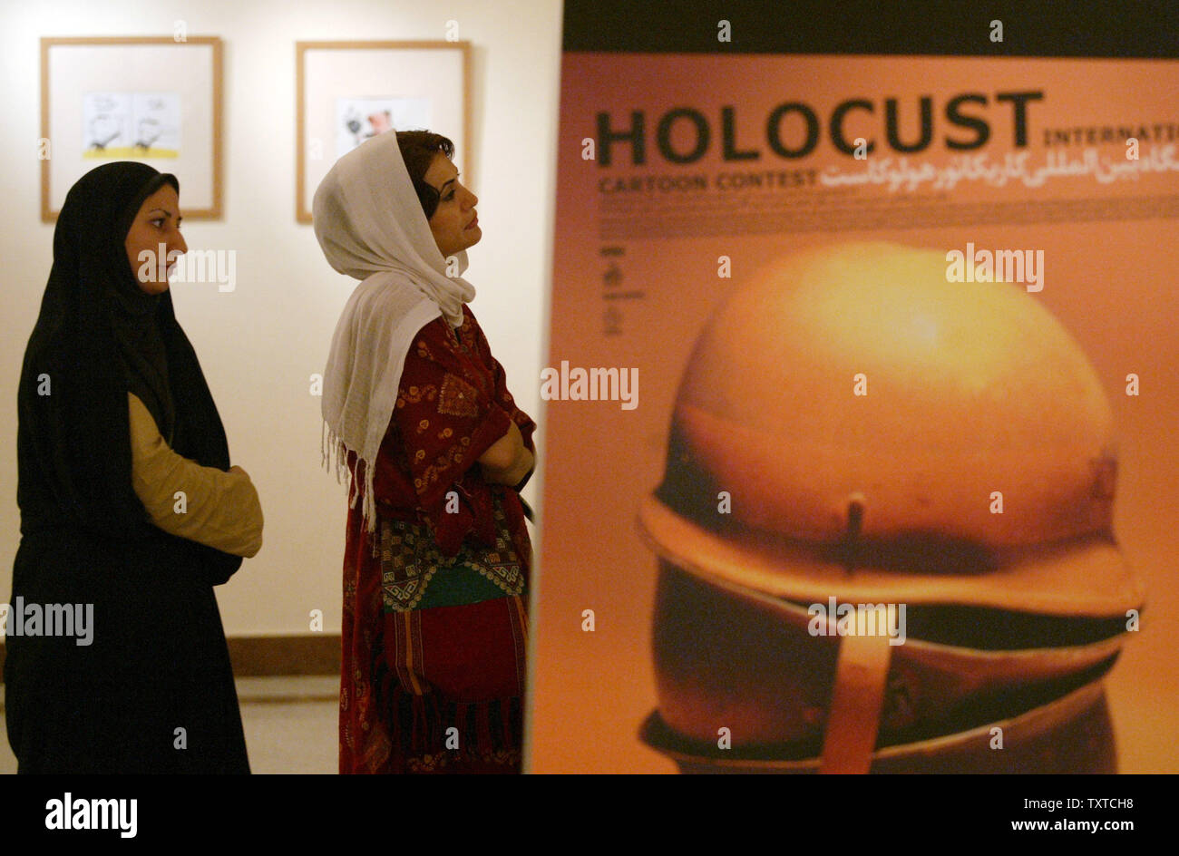 Two Iranian women visit the Holocaust International Cartoon contest ...