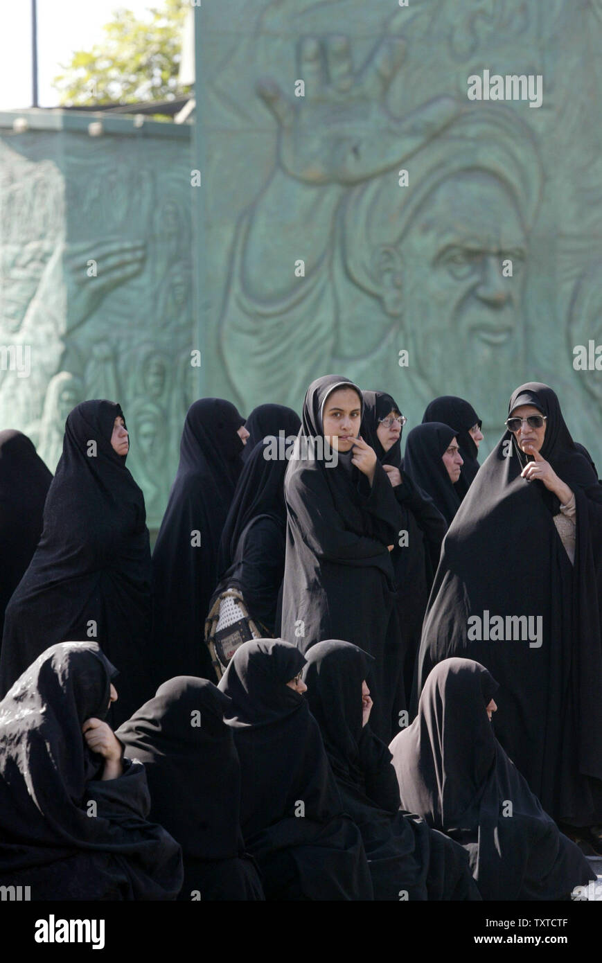 Iranian women protest under a picture of Iran's late supreme leader ...