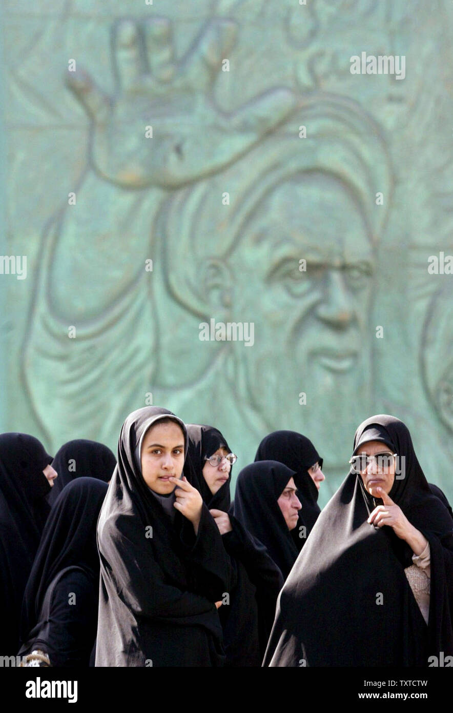 Iranian women protest under a picture of Iran's late supreme leader ...