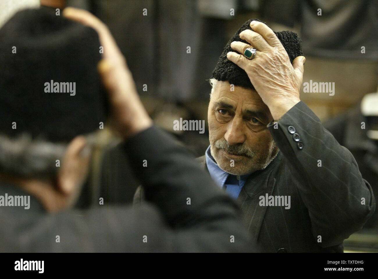 Iranian saddler Nezam Ali Lashani adjusts his Karkula hat or "QaraQul ...