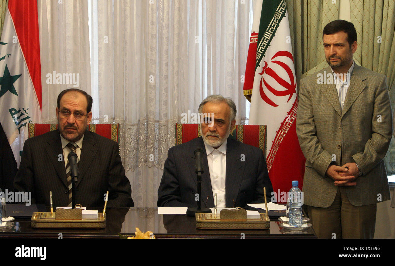 Iran's Vice President Parviz Davoodi (C) and Iraqi Prime Minister Nouri ...