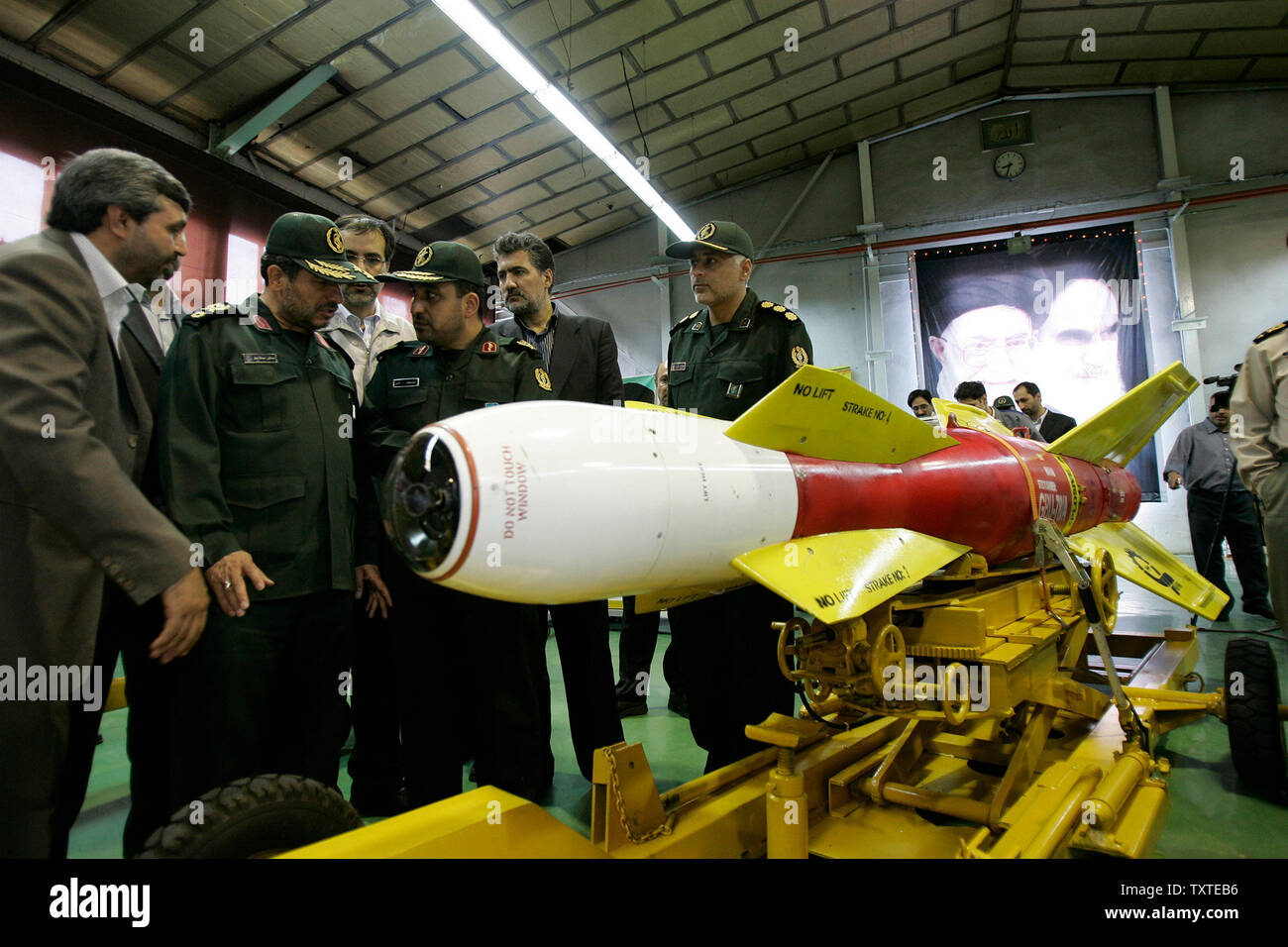 Iran's Defense Minister Mostafa Mohammad Najjar (2nd-L) views a 2000 ...