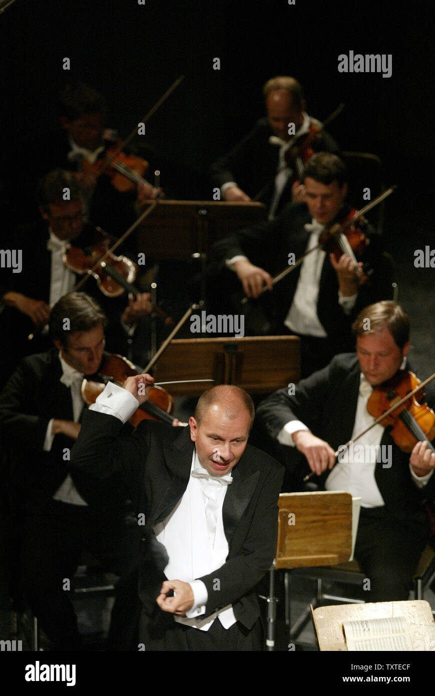 German conductor Hermann Baumer leads the Osnabrueck Symphony Orchestra ...
