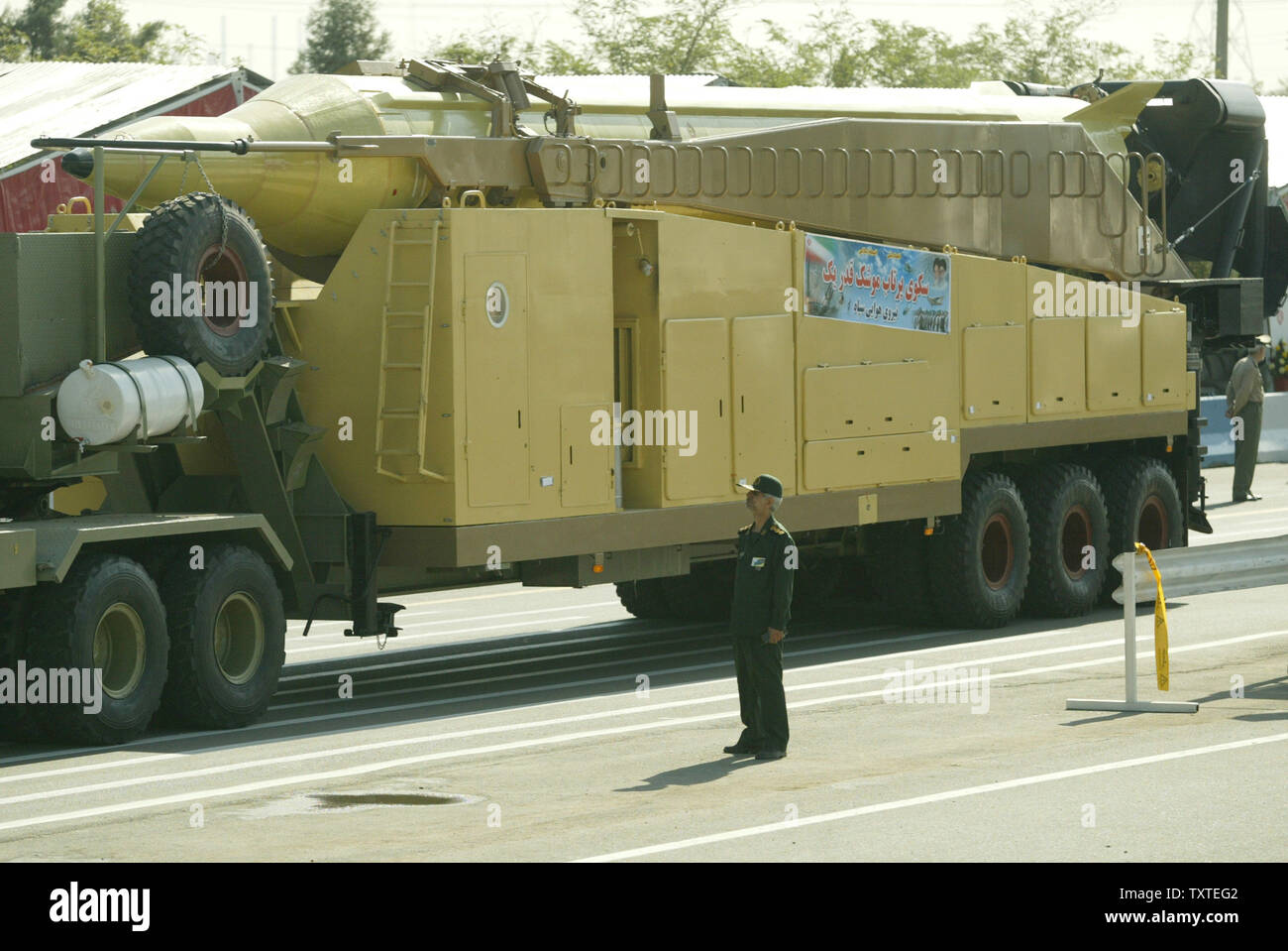 A Iranian military truck transports an new longer-range "Ghadr-1 ...