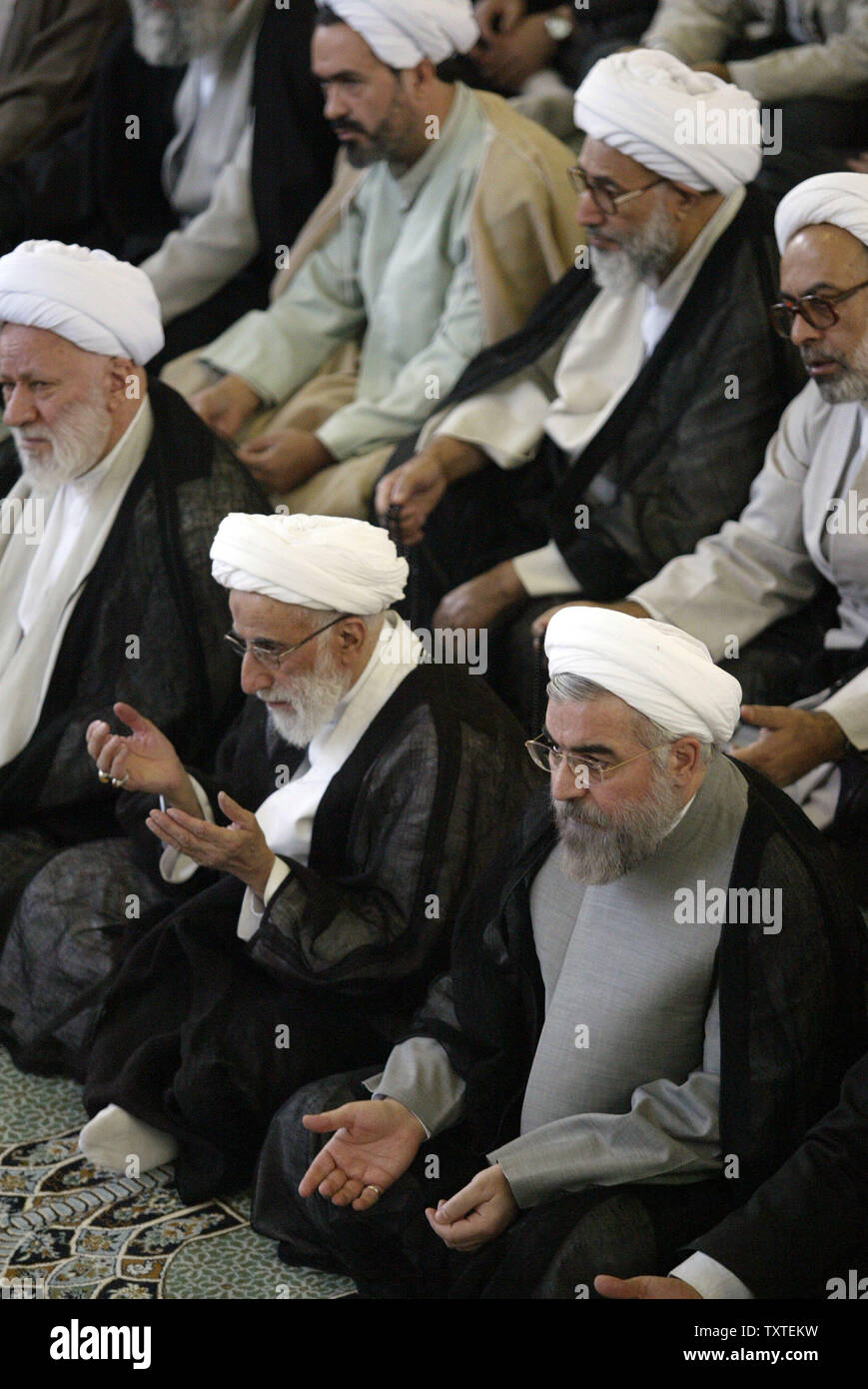 Former Iran's top nuclear negotiator Hassan Rohani (R-bottom) and ...