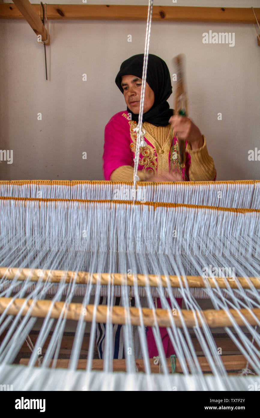 Khizana, Chefchaouen, Morocco - May 2, 2019: a Moroccan woman weaving ...