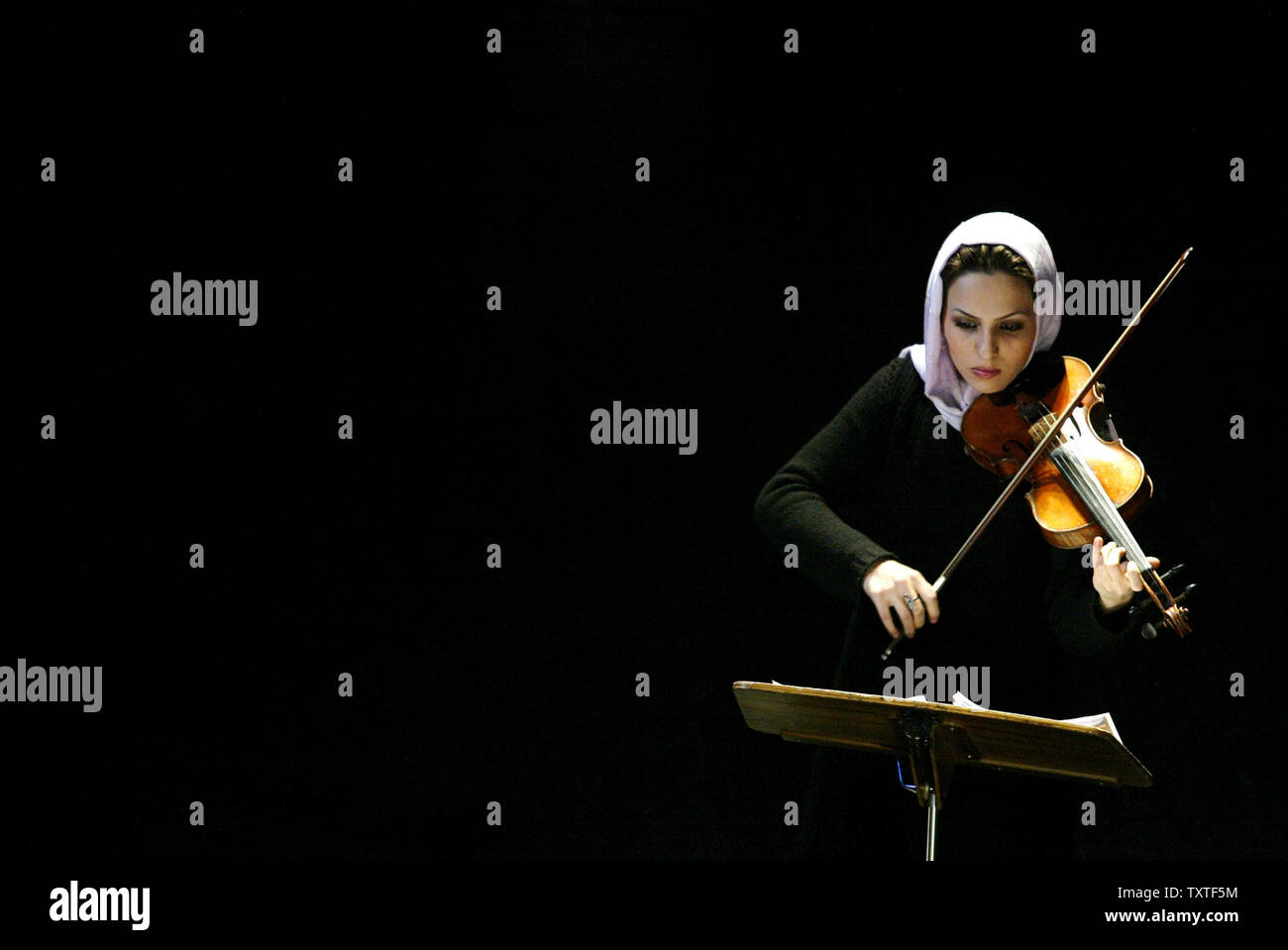 Monica Loran plays violin at the 23rd International Fajr Music Festival ...