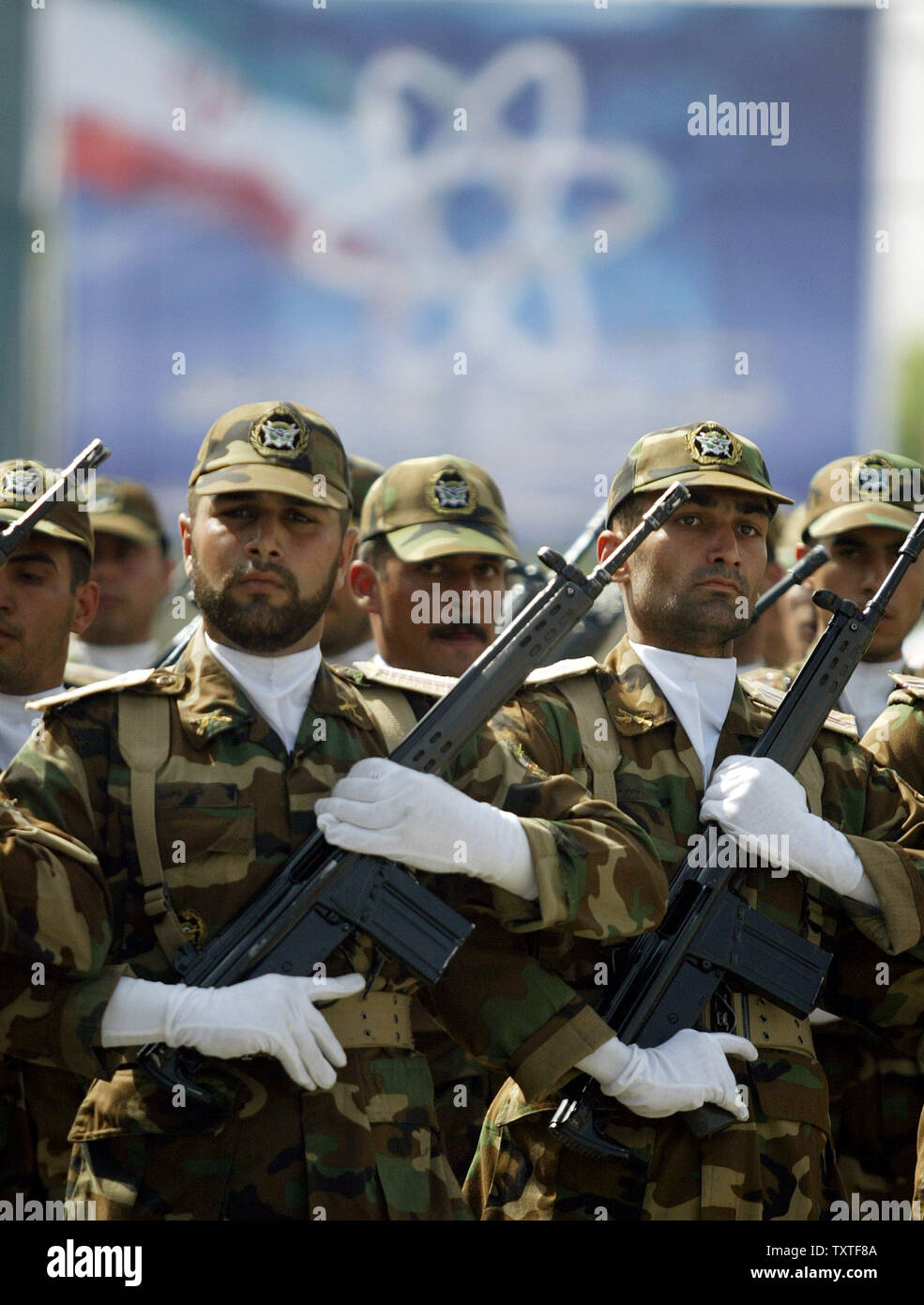 Iranian Army soldiers march under a nuclear banner during Iran's Army ...