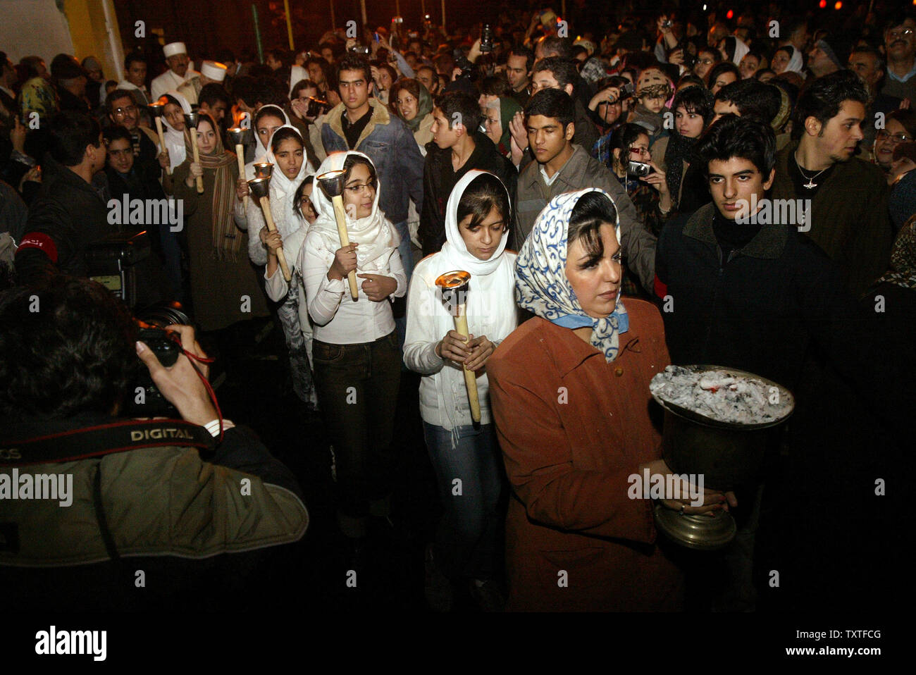 Iranian Zoroastrians women carry cups of fire during the Zoroastrian ...