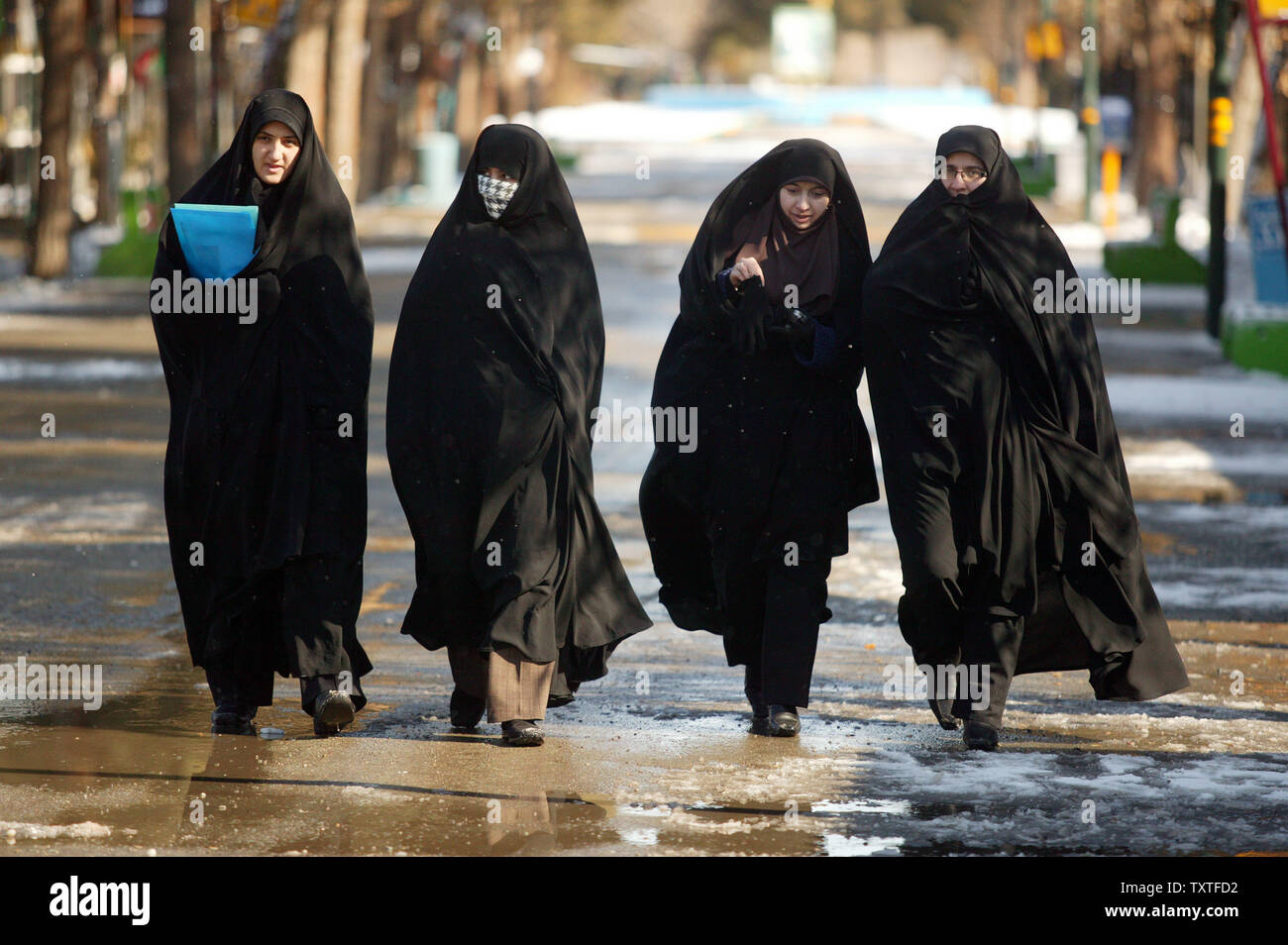 Iranian women make their way through martyrs cemetery for those killed ...