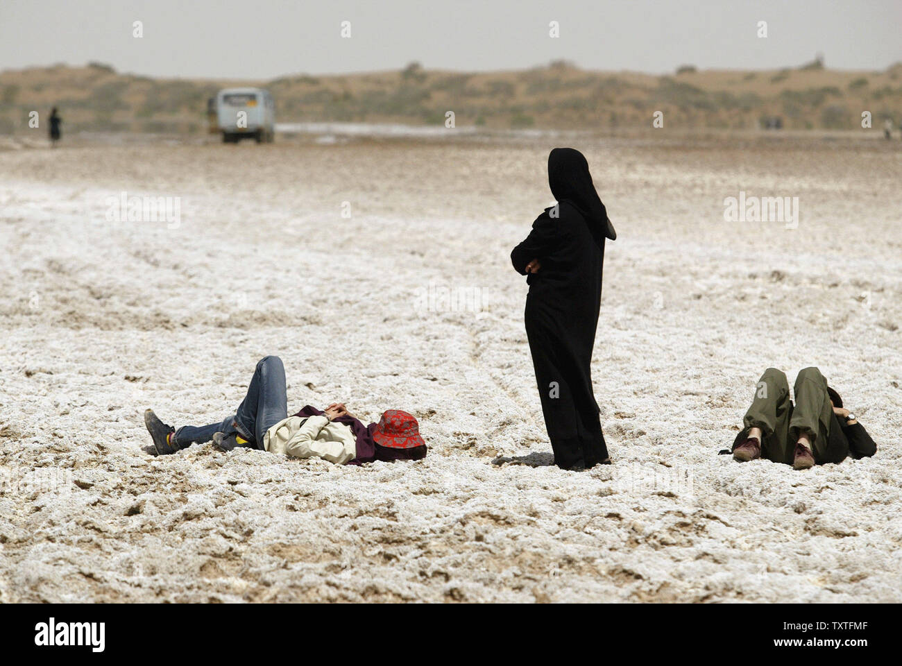 Iranians take rest on the Salt Lake near the Aran and Bidgol villages ...