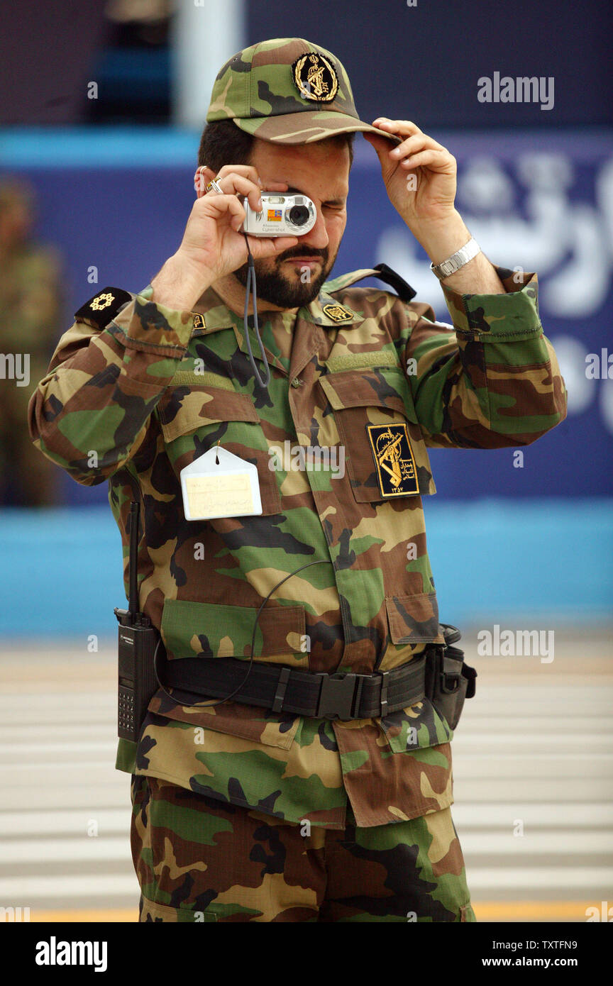Iranian Revolutionary Guard soldier takes an snap shot during Iran's ...