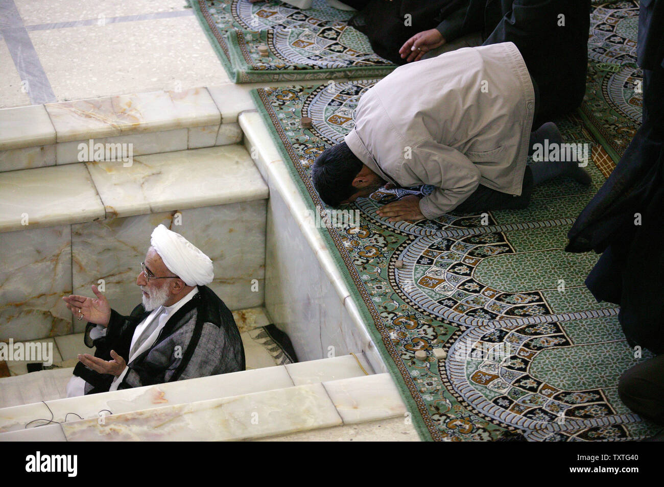 Iranian cleric Ahmad Janati (L), who chairs the powerful Guardians ...