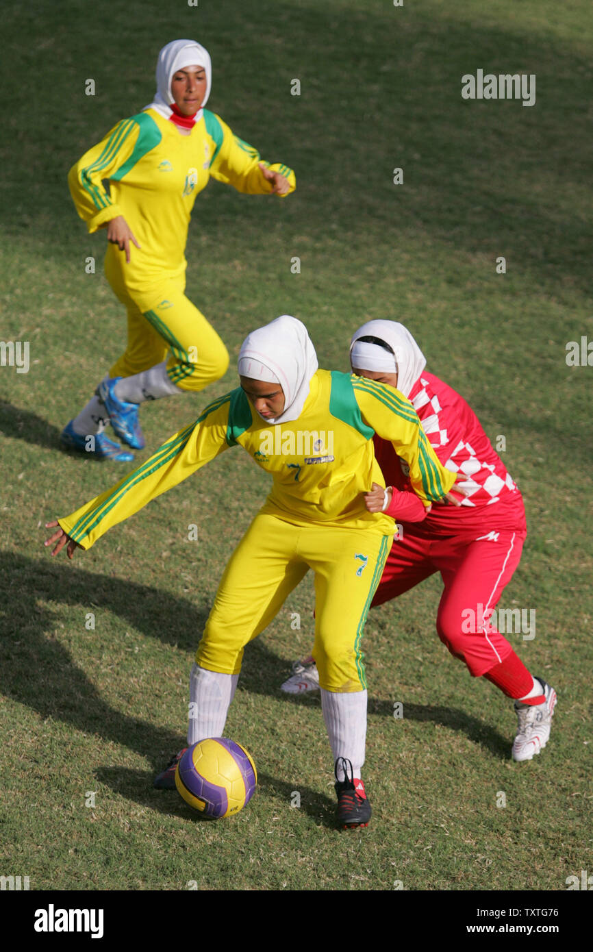Iranian veiled football players, Samaneh Khodabandeh (in red) and ...