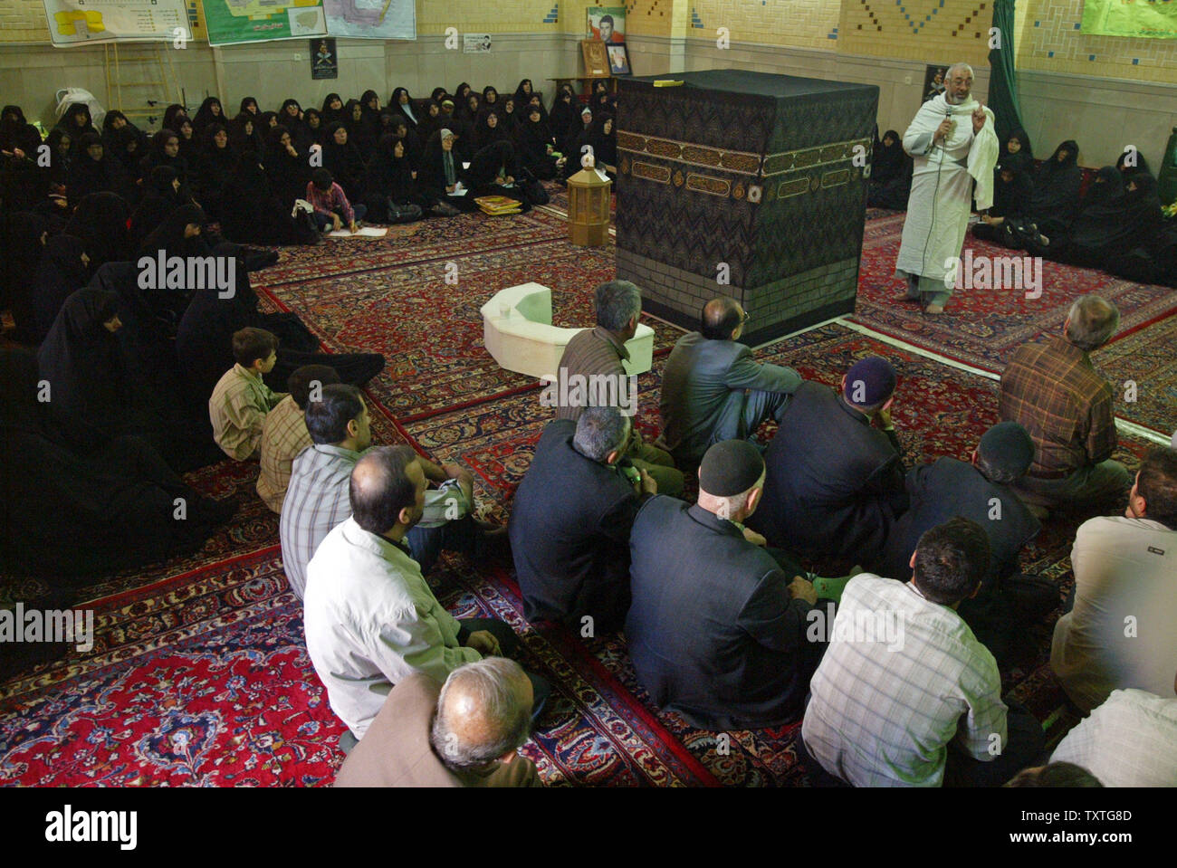 Iranian Hajj pilgrims listen to clergyman Seyyed Ghoreish Mousavi (next ...