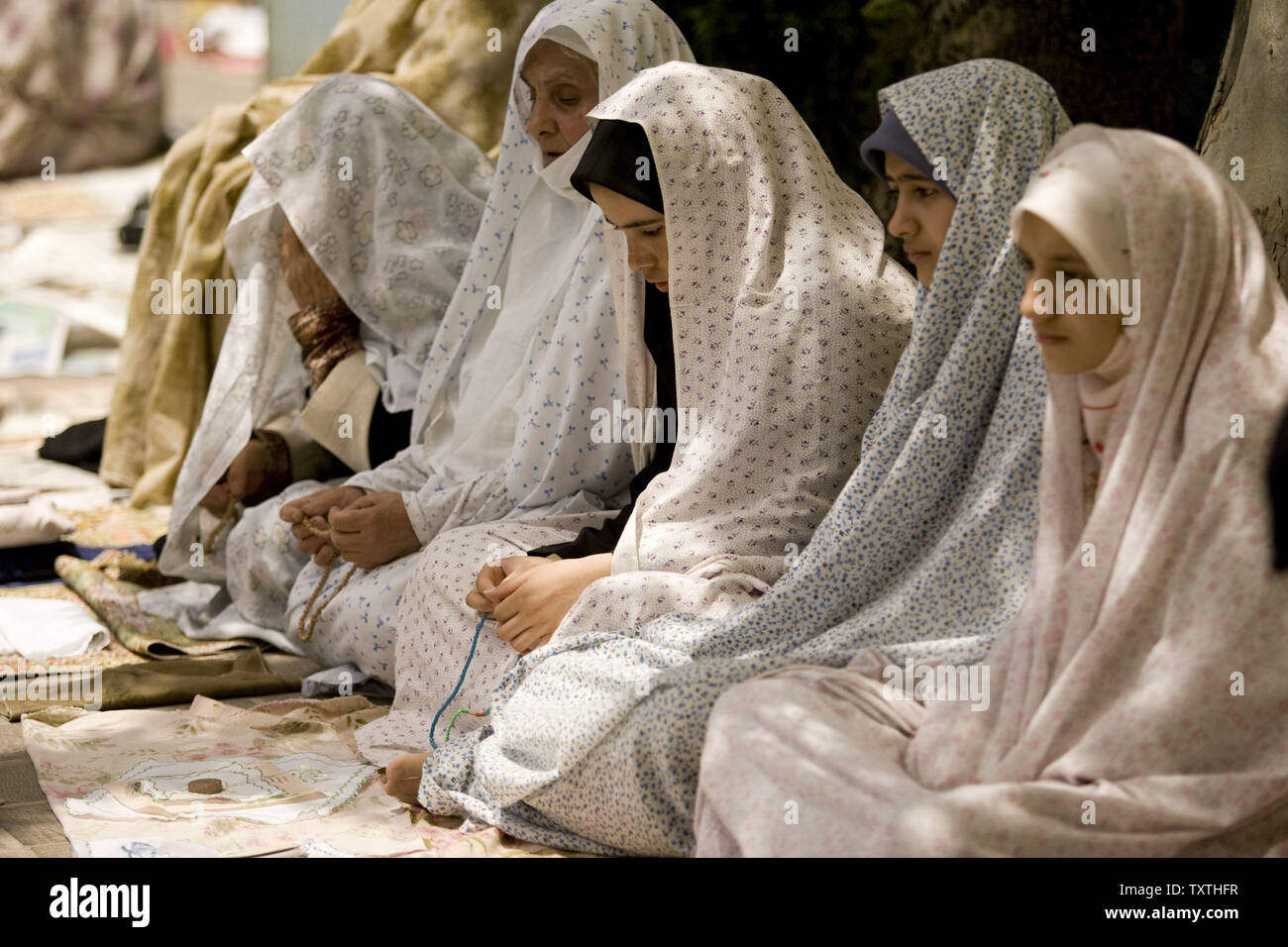 Iranian women pray as they attend Friday Prayer at Tehran University ...