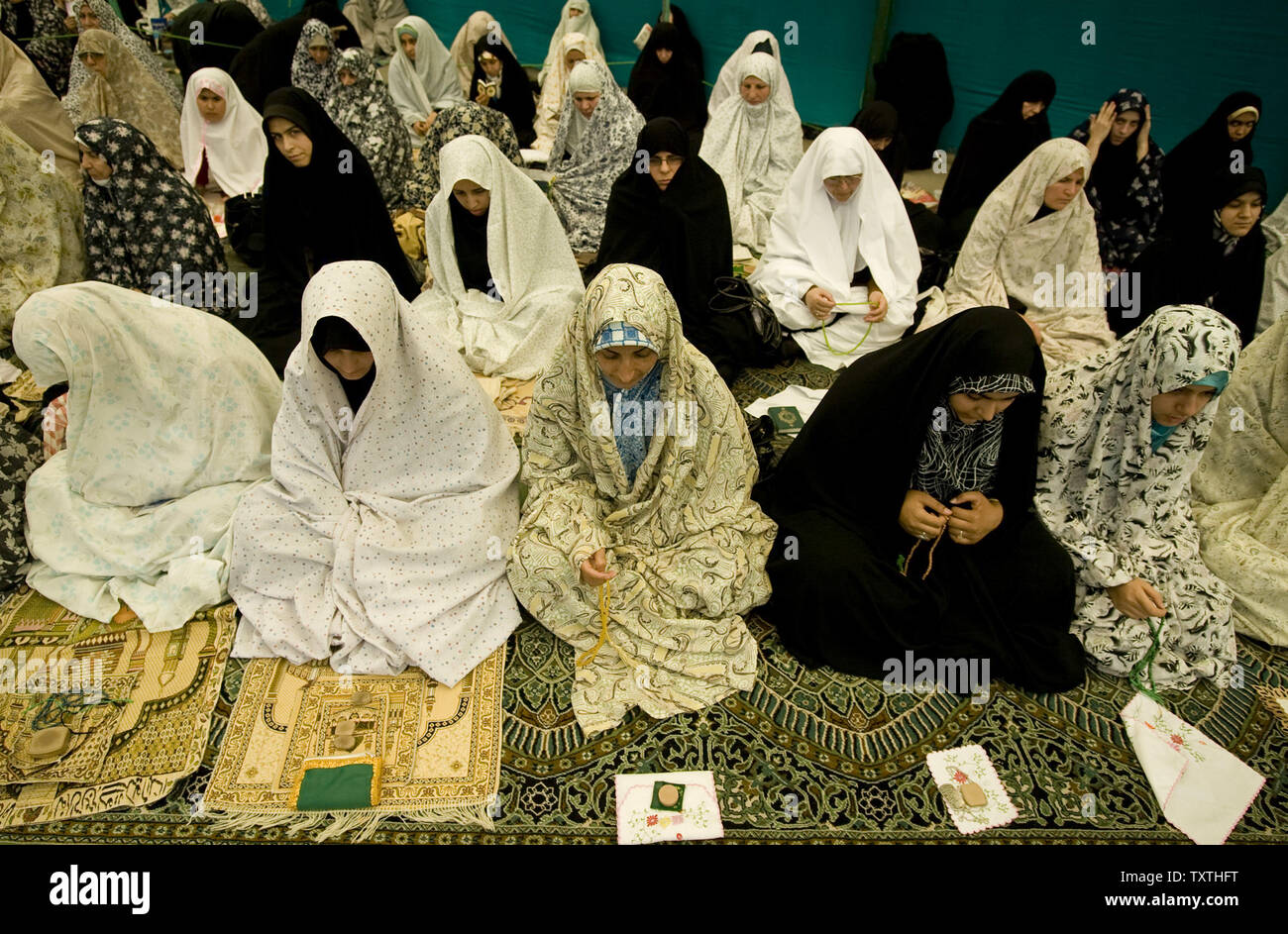 Iranian women pray as they attend Friday Prayer at Tehran University ...