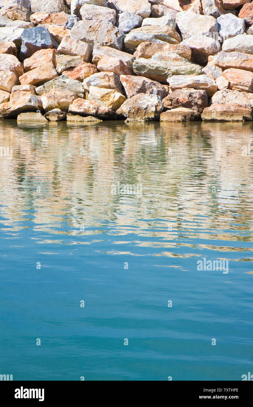 Dam with stone blocks for protection from sea storms - image with copy ...