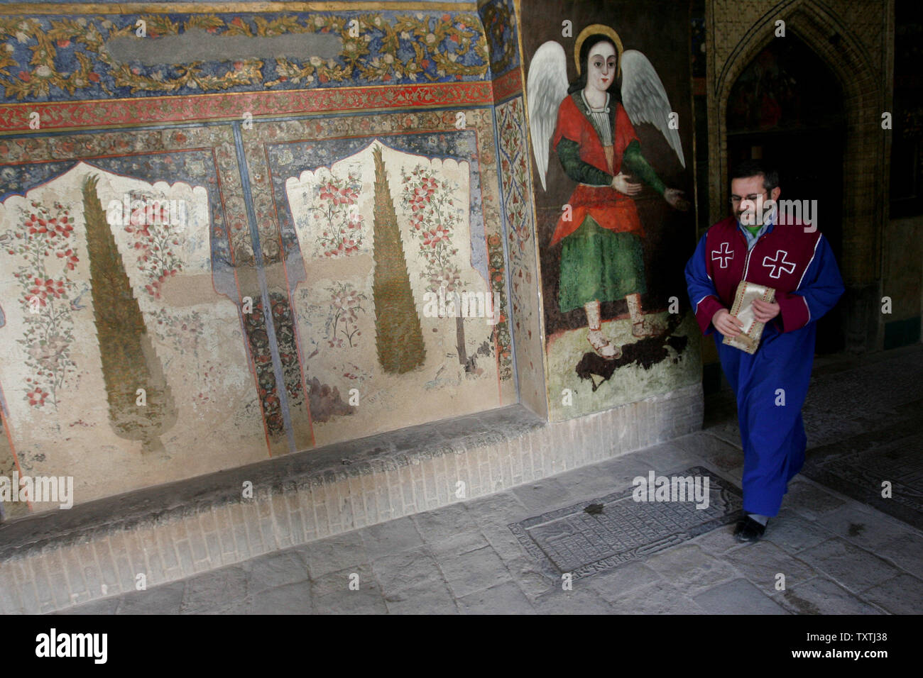 A priest prepares to conduct a new year's day service for Iranian ...