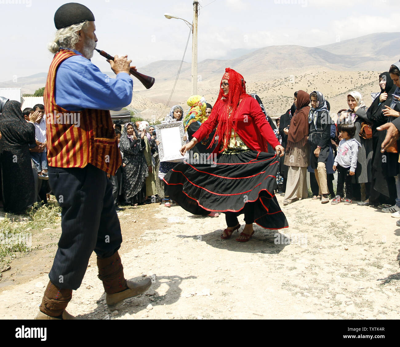 An Iranian man plays an ancient Persian woodwind musical instrument ...