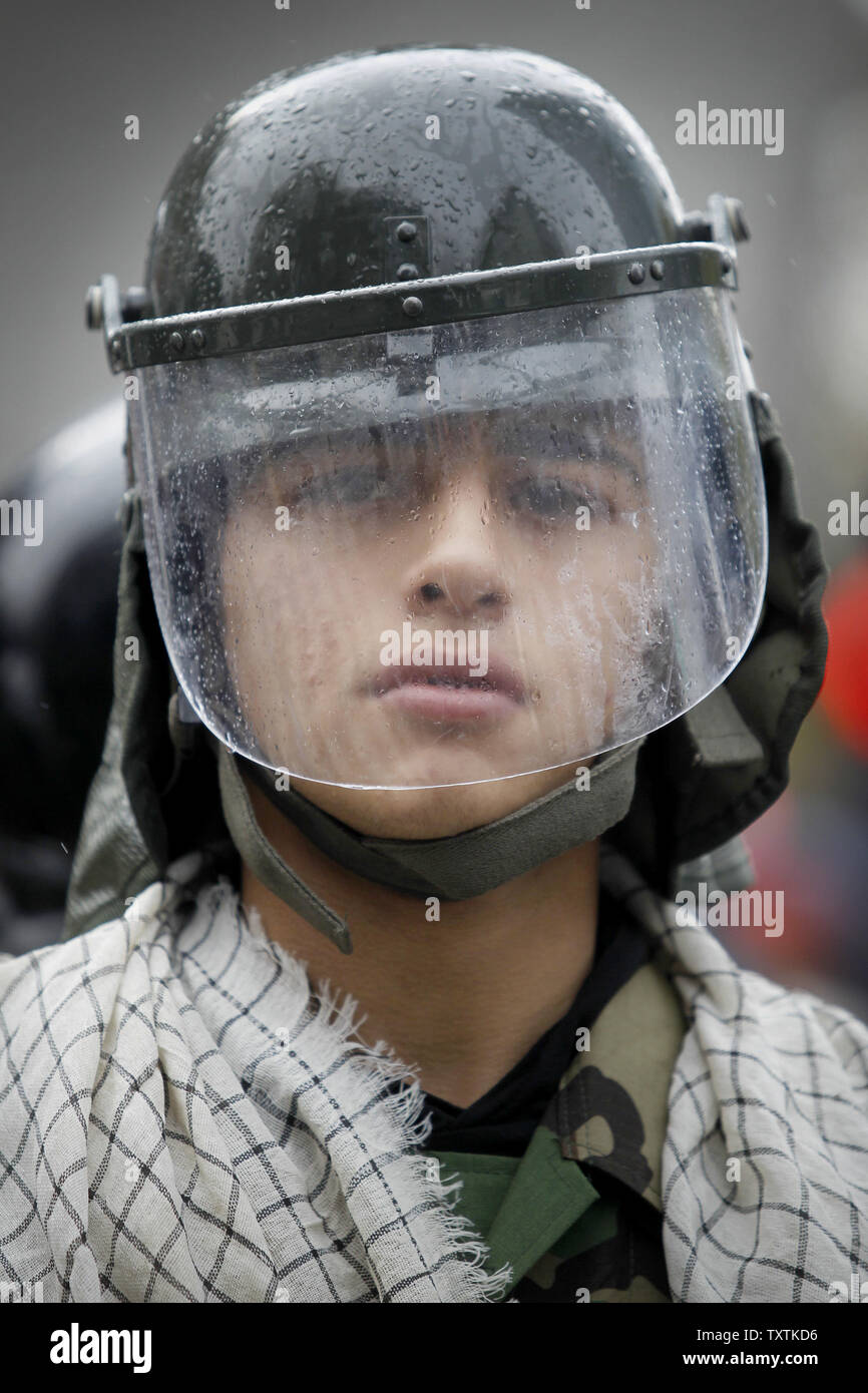 A members of Iran's hardline Basij militia attends a rally marking ...