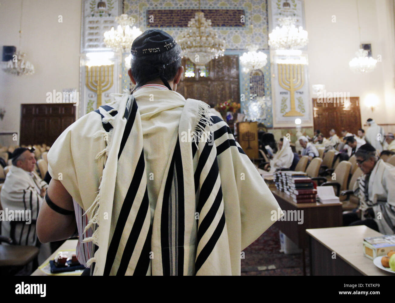 Iranian Jews attend morning service in Tehran Synagogue on December 27 ...