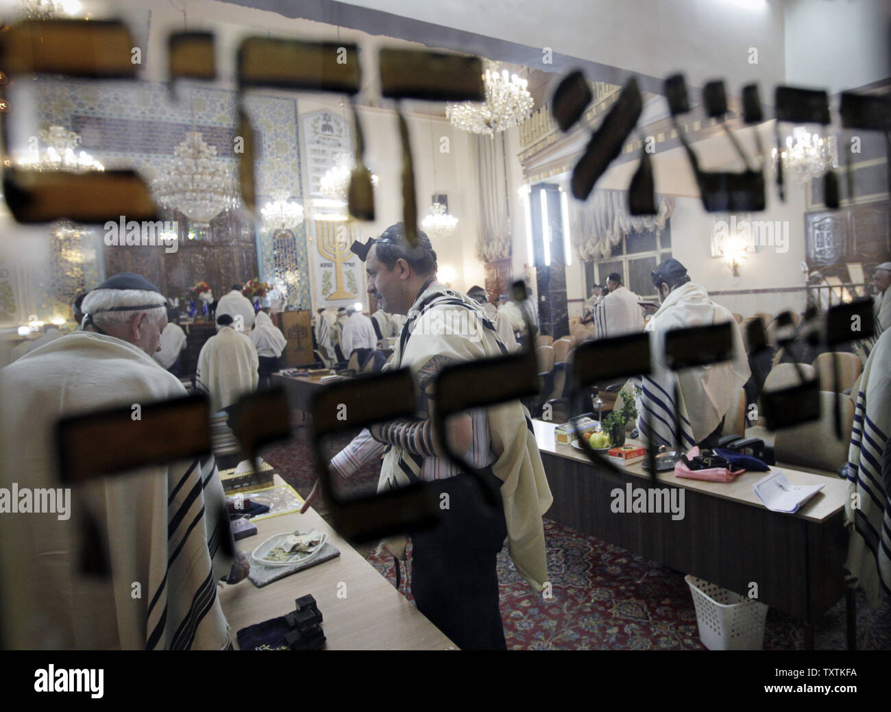 Iranian Jews attend morning service in Tehran Synagogue on December 27 ...