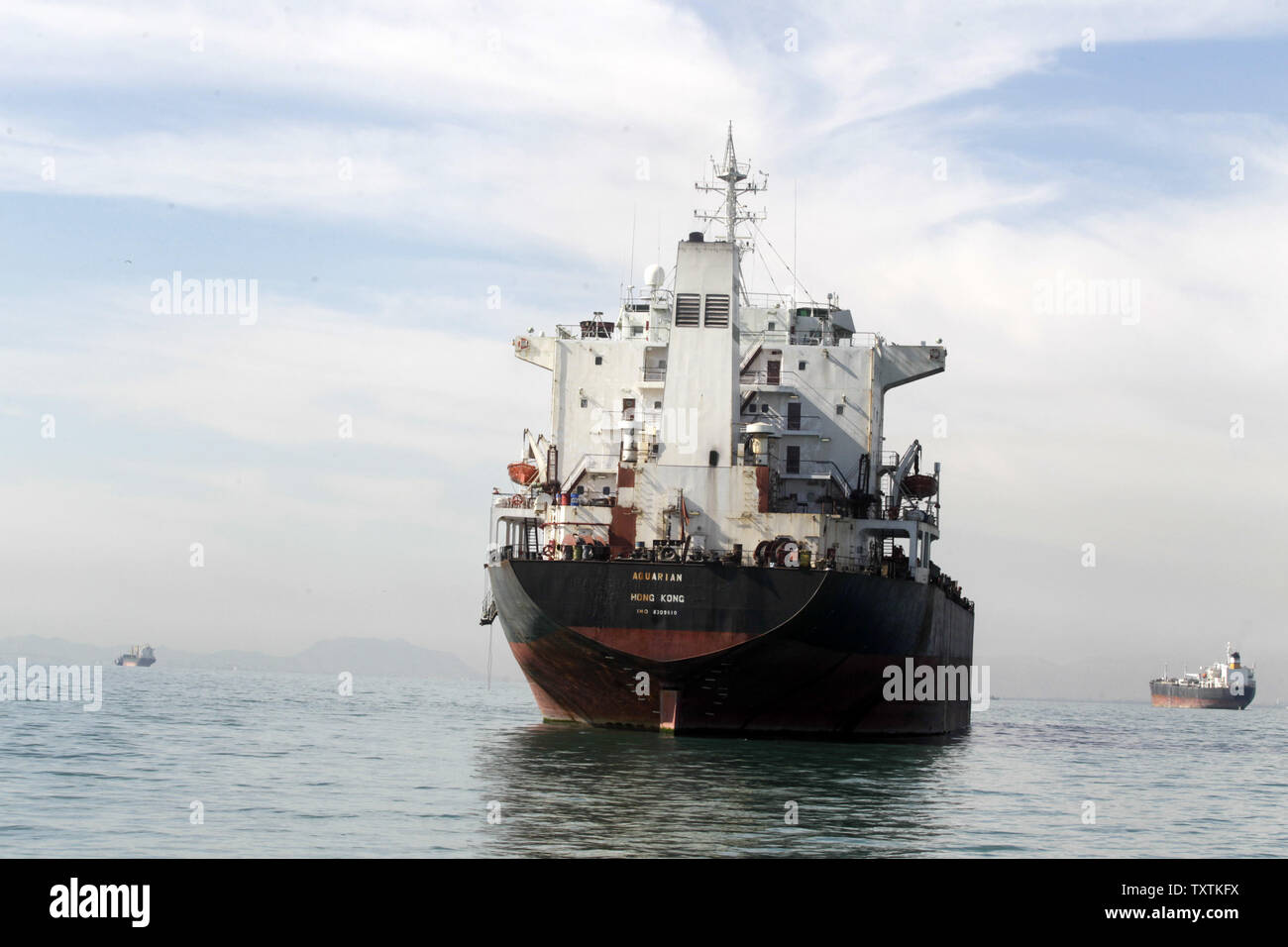 A cargo ship is seen in between Iranian city port of Bandar Abbas and ...