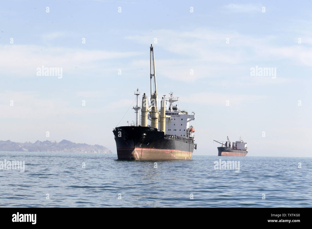 A cargo ship is seen in between Iranian city port of Bandar Abbas and ...
