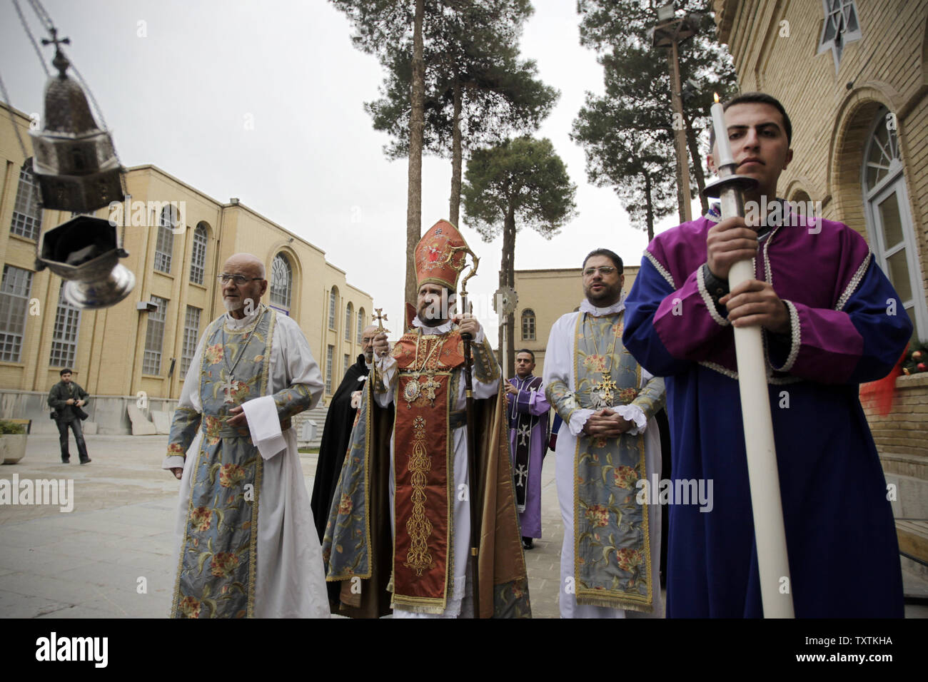 Bishop Charian (Second-left) leads Iranian Christians in a New Year's ...