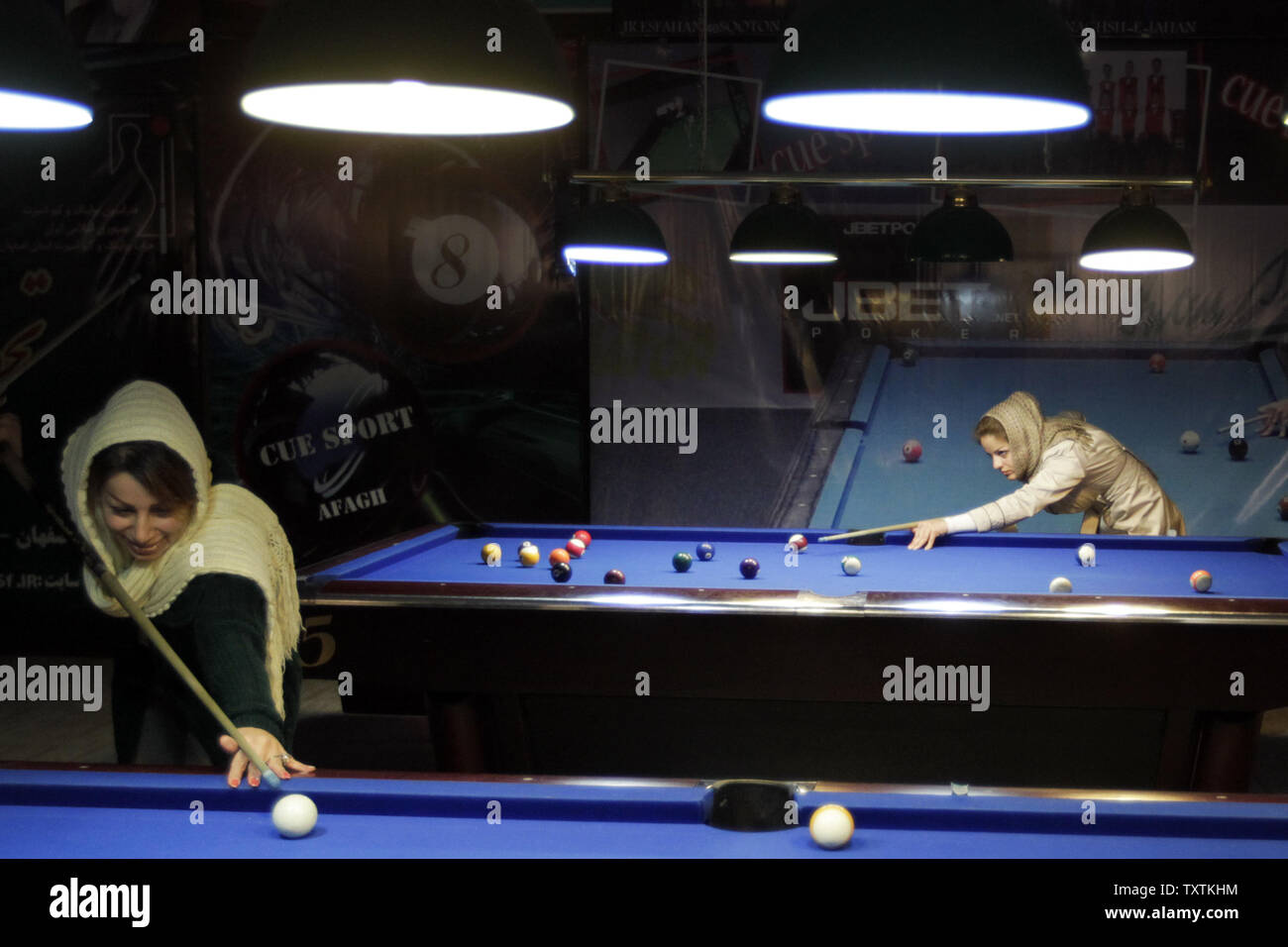 Iranian women play billiards in a sports center in Isfahan, Iran on ...