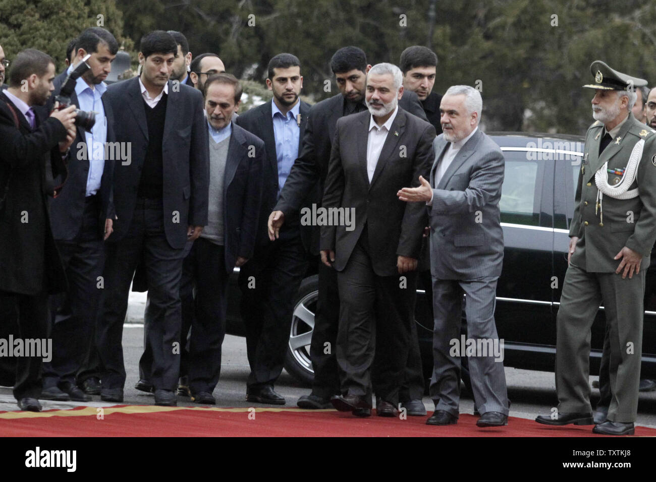 Iran's First Vice President Mohammad Reza Rahimi (R) greets Hamas ...