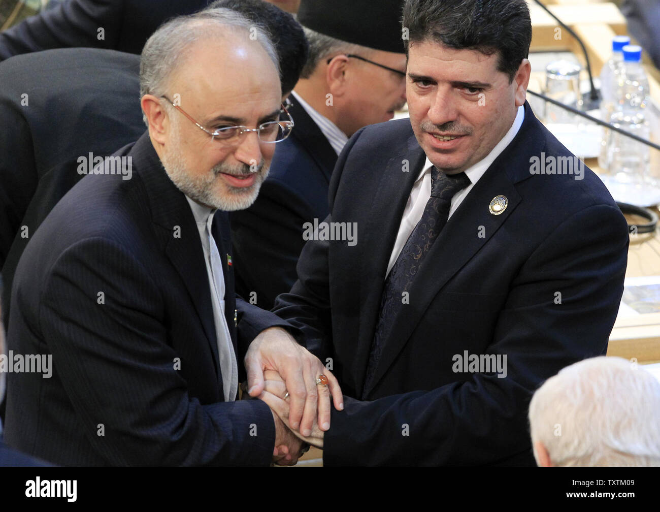 Iranian Minister of Foreign Affairs, Ali Akbar Salehi (L) greets Syrian ...