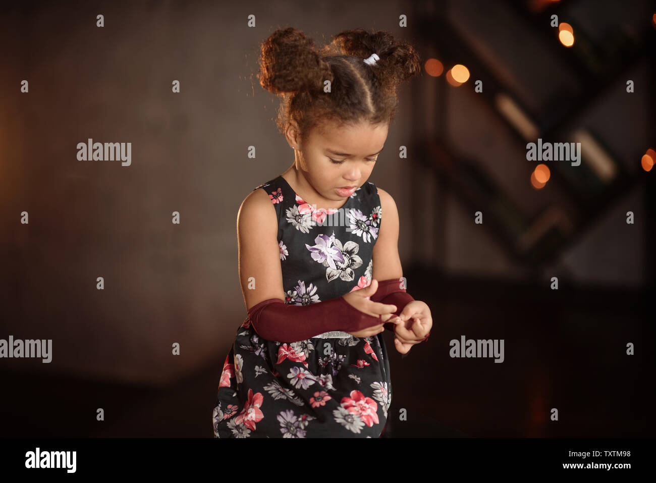 Beautiful sad little girl crying, on light background Stock Photo - Alamy