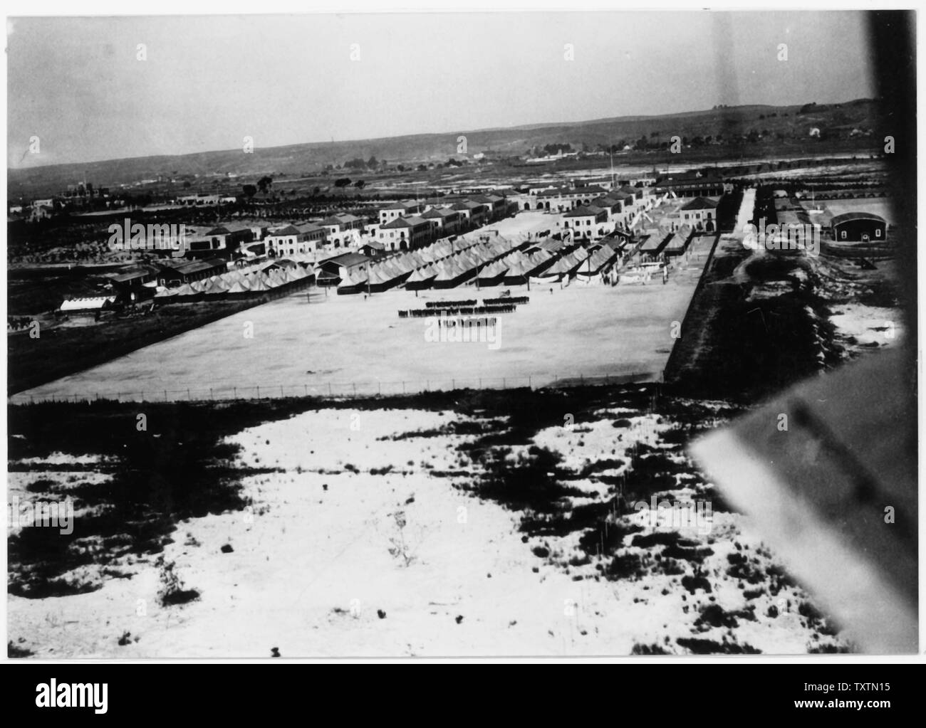 [Aerial view of new training station buildings and temporary tents ...
