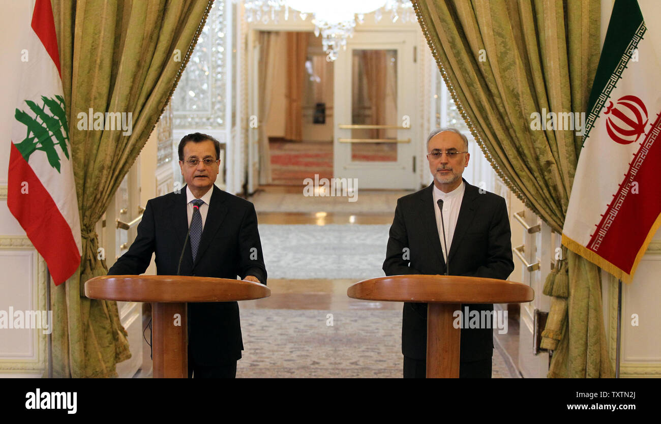 Lebanese foreign minister Adnan Mansour (L) speaks during a joint news ...