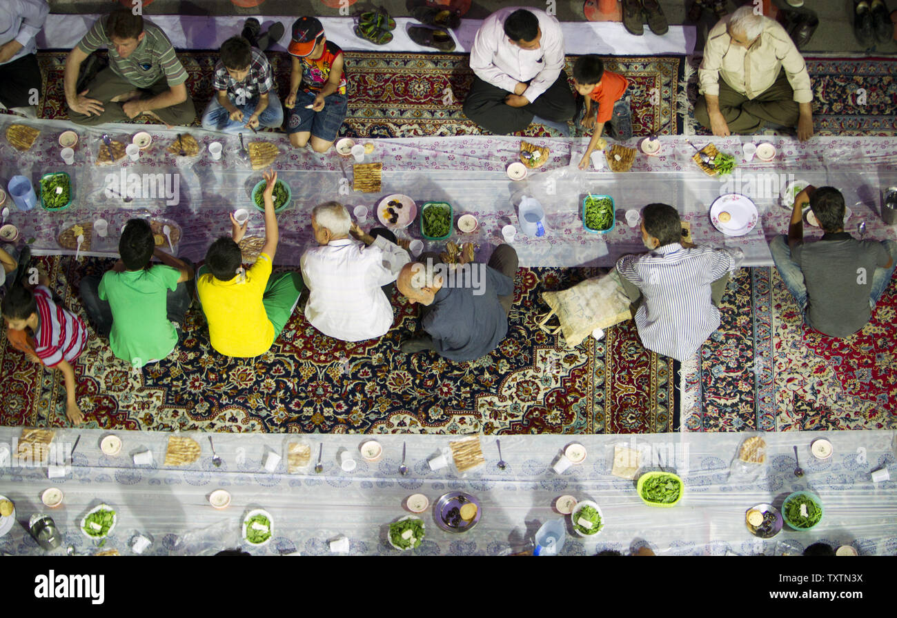 Iranians eat Iftar during the holy month of Ramadan in Tehran, Iran on ...
