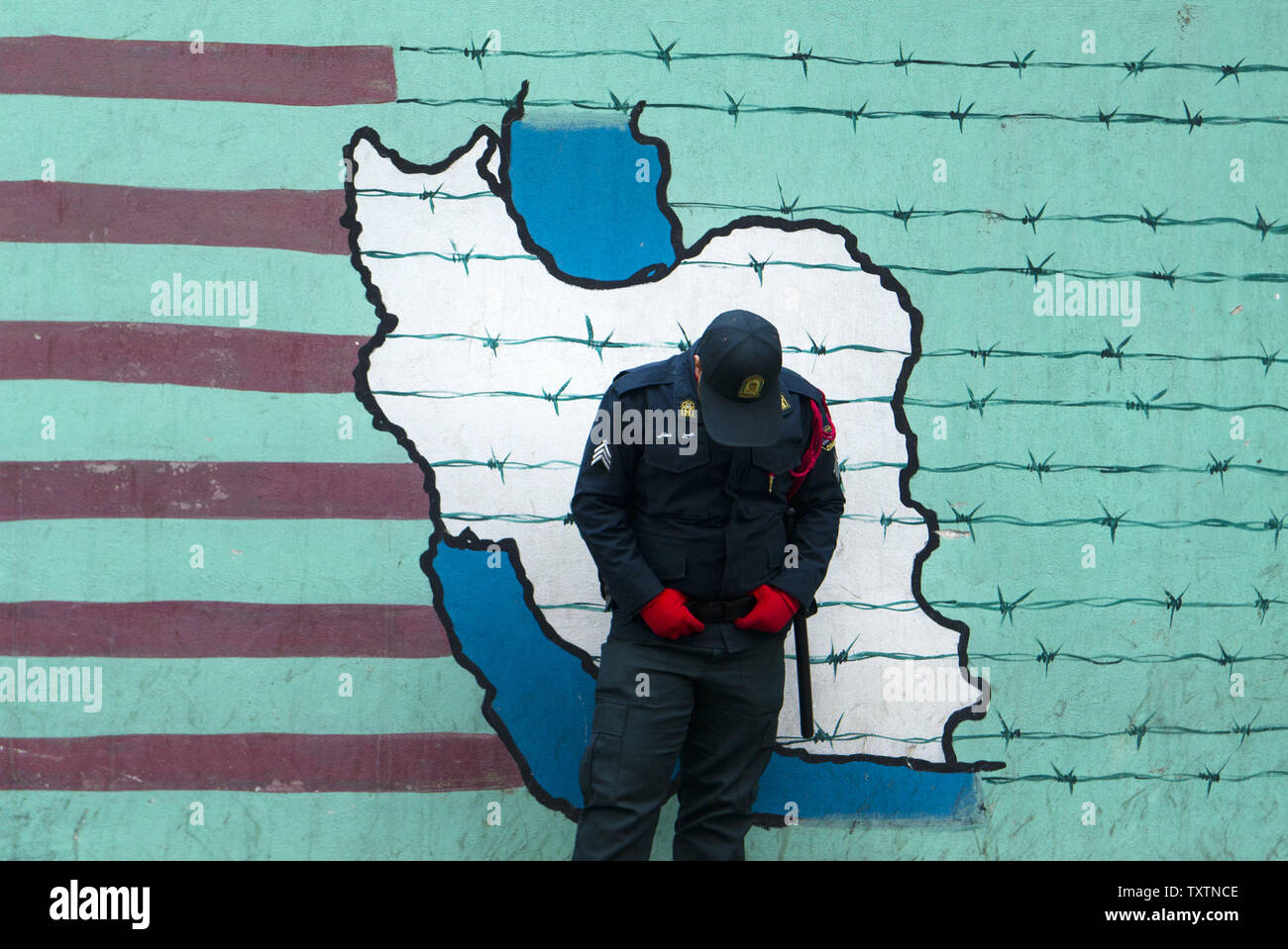 An Iranian solider stands guard in front of the former U.S Embassy in ...