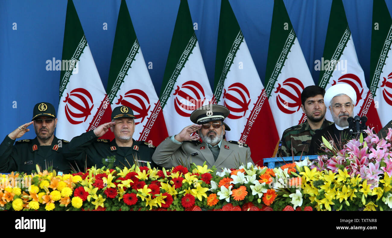 Iranian President Hassan Rouhani (R) speaks as Revolutionary Armed ...