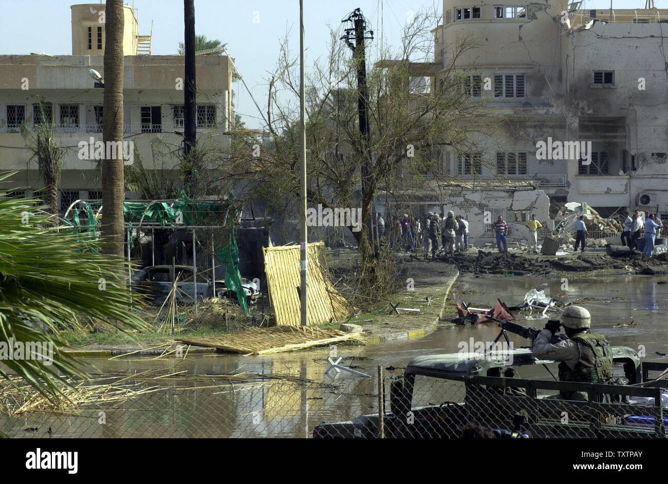 U.S. soldiers and rescue workers servey the situation in the aftermath ...