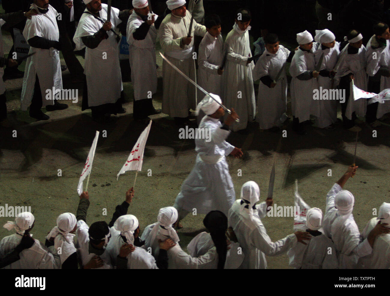 Pilgrims attend a religious ceremony in Karbala, Iraq on January 7 ...