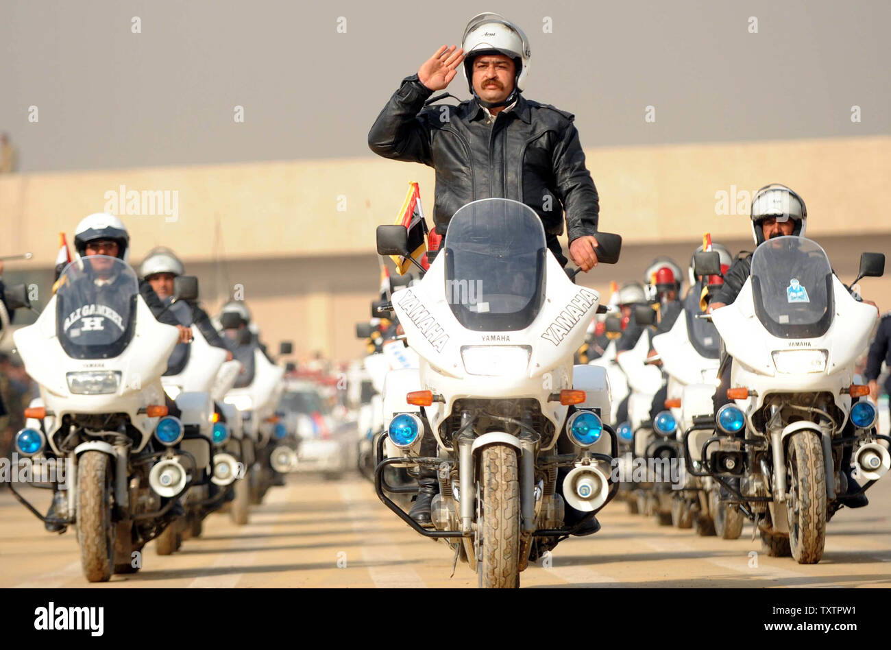 Iraqi national police celebrate during a Police Day ceremony in Baghdad ...